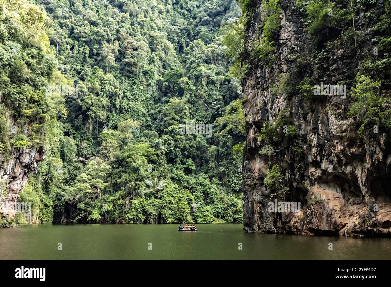 Limestone mountains scenery Mirror lake with small boat in Perak ...