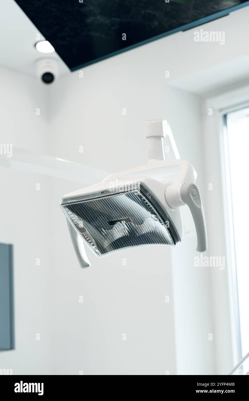 Dental examination light illuminating a modern clinic room by the ...