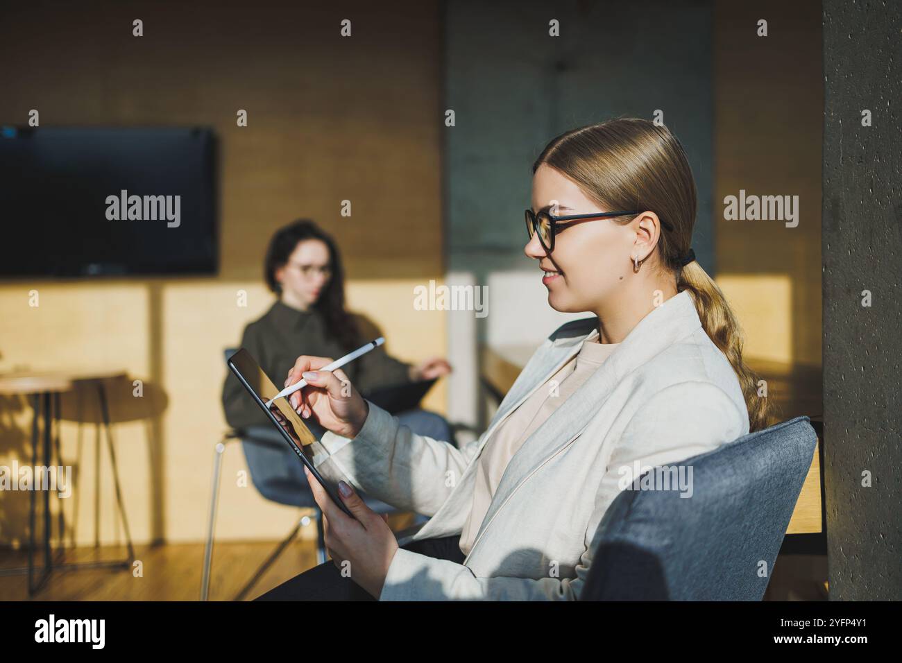 Office work, attractive young female manager working in office ...