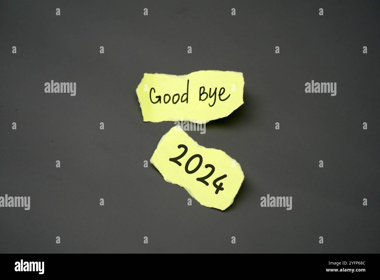 handwritten text "Good bye 2024" on a yellow torn paper Stock Photo - Alamy