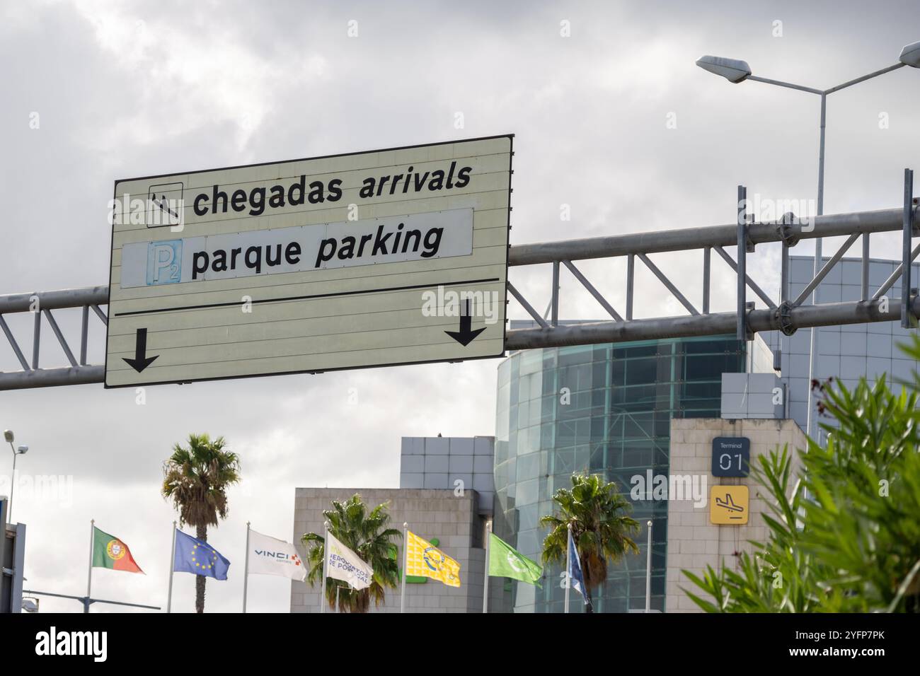 Road sign indicating arrivals and parking at faro airport, portugal ...