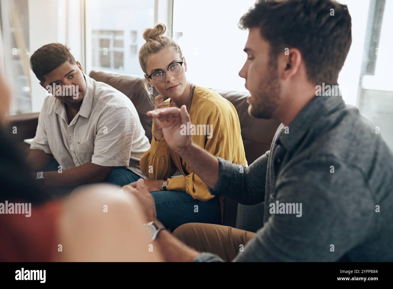 Man, team and talking in office with planning, huddle and brainstorming ...