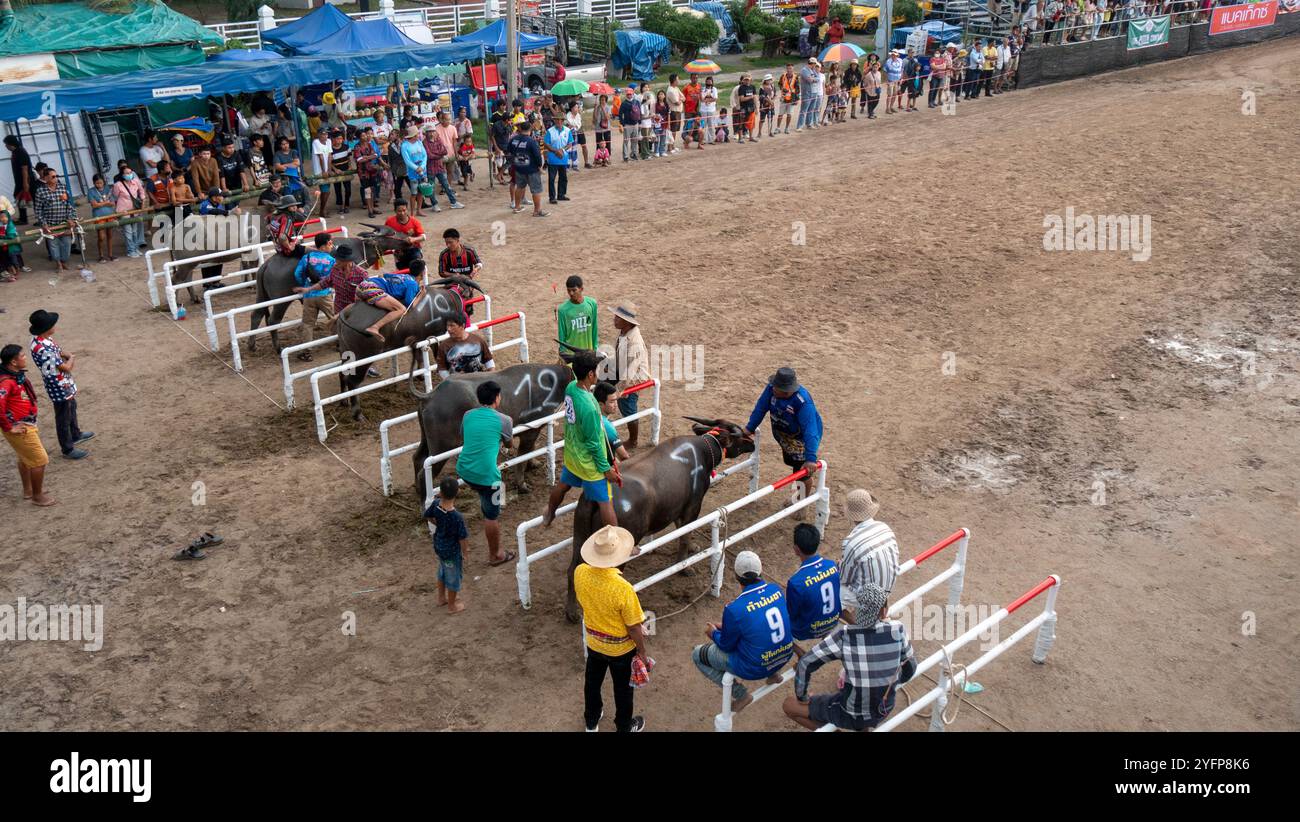 Jockeys prepare to start a race at the153rd Annual Chonburi Buffalo ...