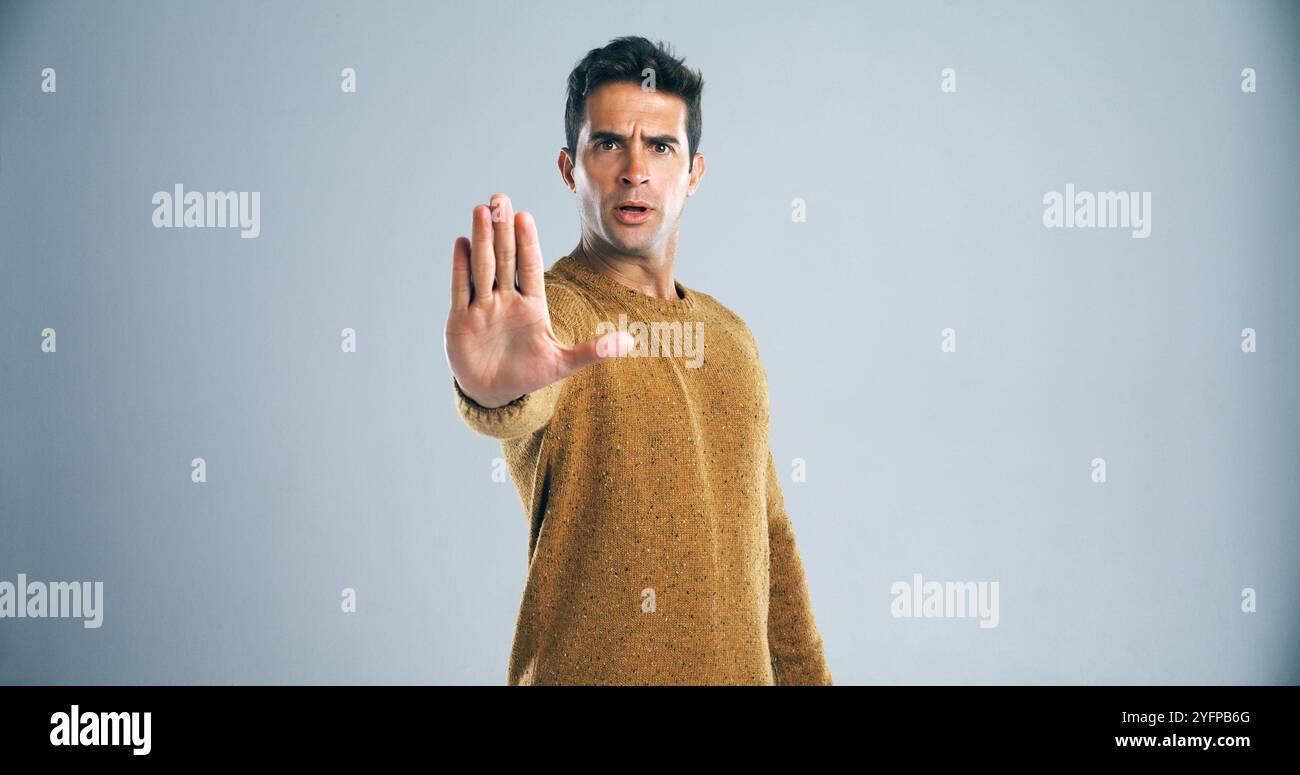 Hand, no and portrait of man in studio with palm gesture for rejection ...