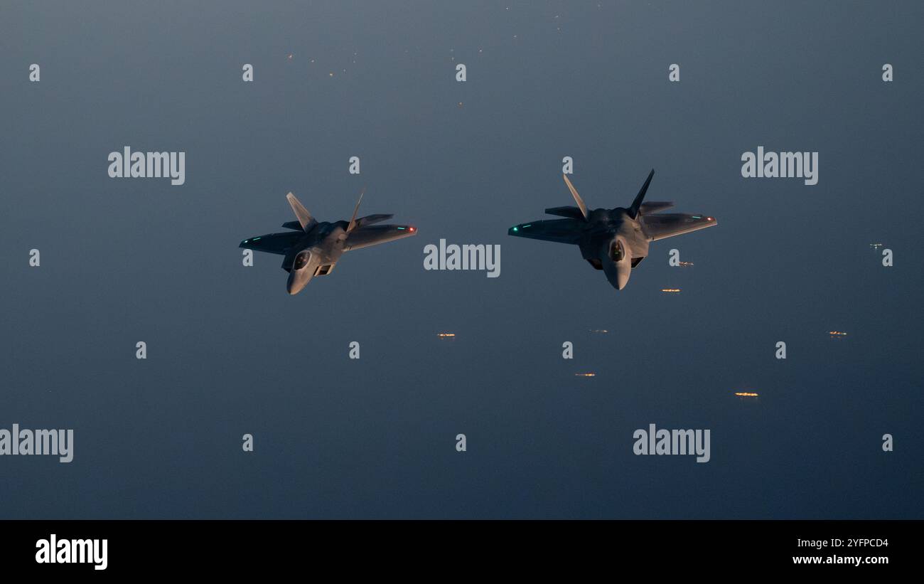 Two U.S. Air Force F-22 Raptors fly in formation over the U.S. Central ...