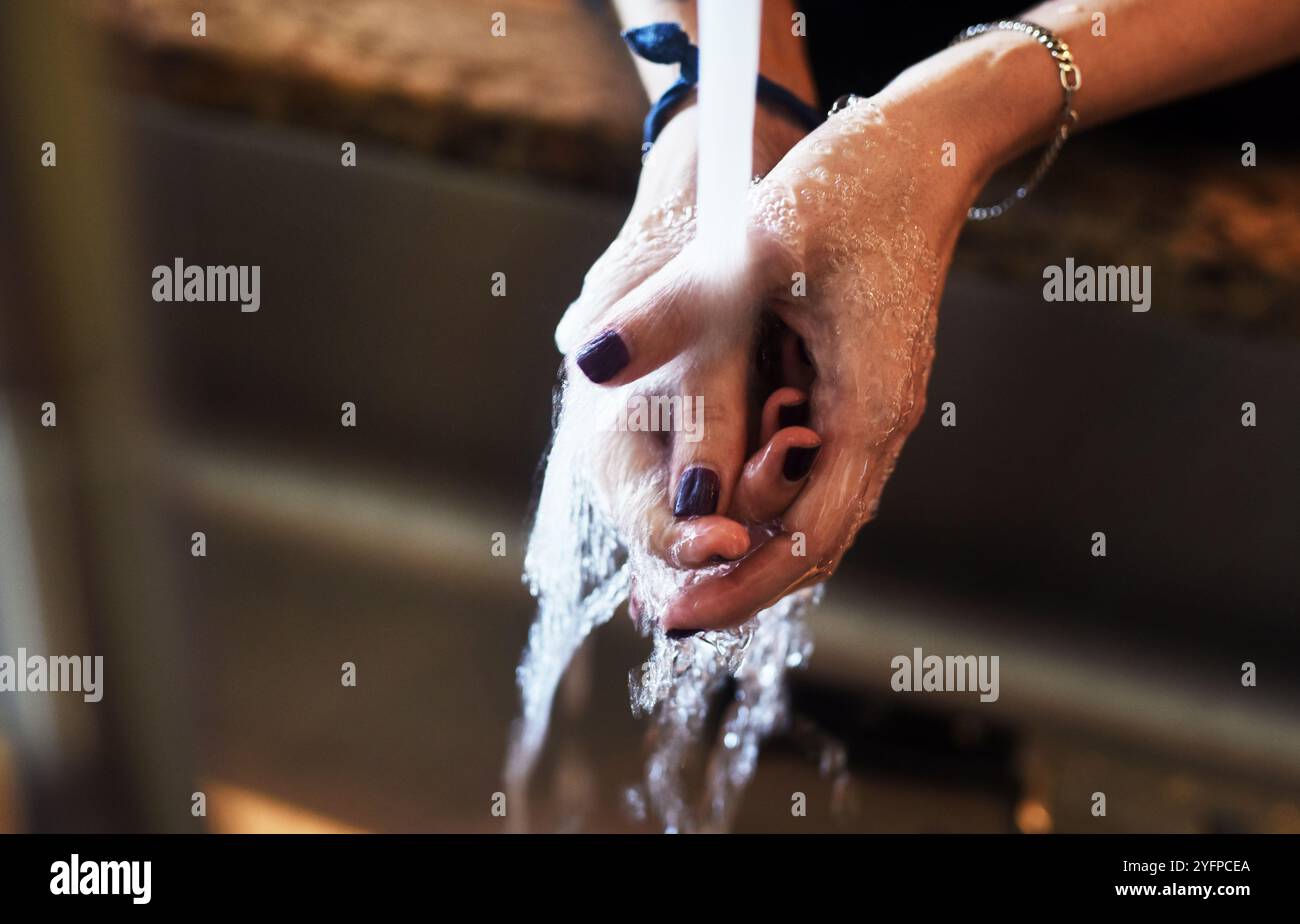 Woman, water and washing hands in home for hygiene, bacteria prevention ...