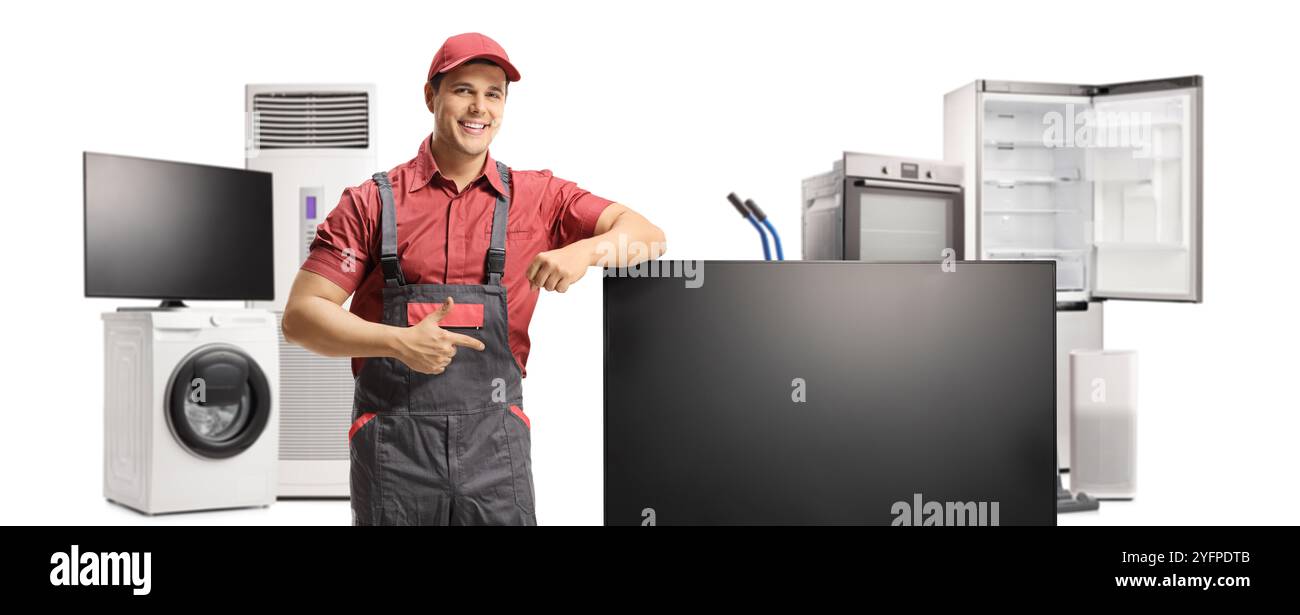 Sales man with home appliances pointing at a tv screen isolated on ...