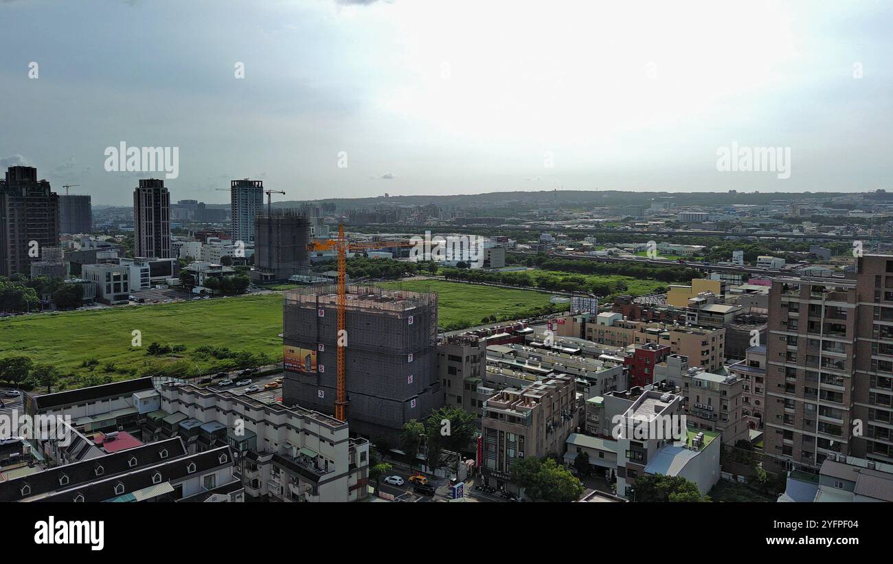 In an aerial view, traffic passes by Xitun District in Taichung, Taiwan ...