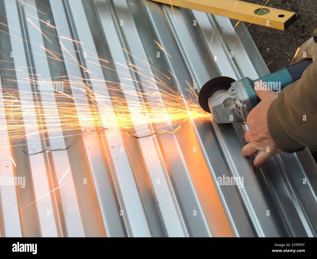 Builder using metal grinder cutting hi-res stock photography and images ...
