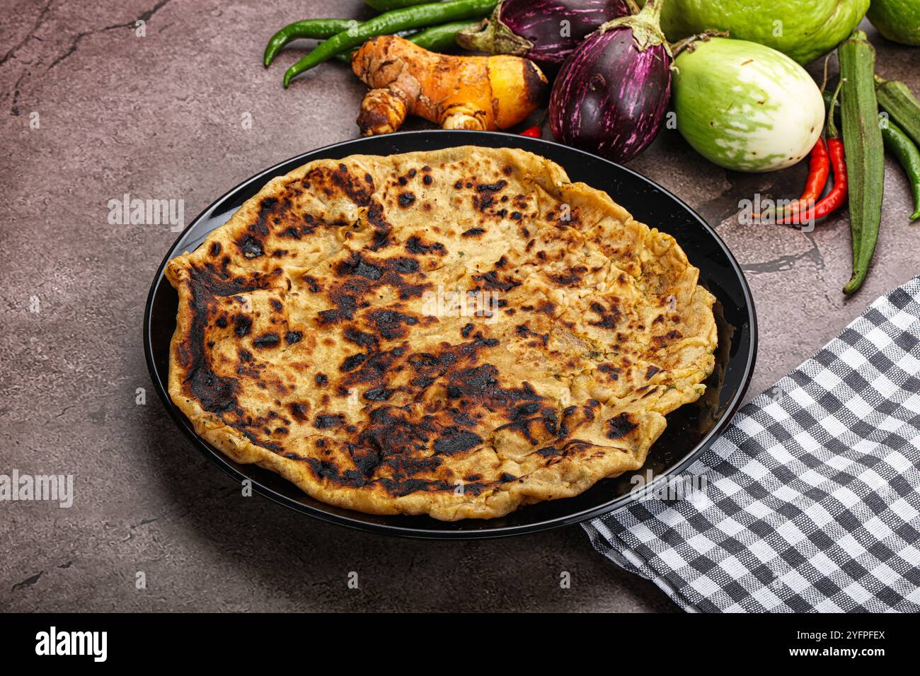 Indian cuisine stuffed Aloo paratha - bread with potato Stock Photo - Alamy