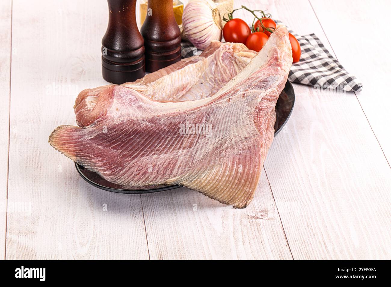 Raw uncooked stingray fish wing in thw plate Stock Photo - Alamy