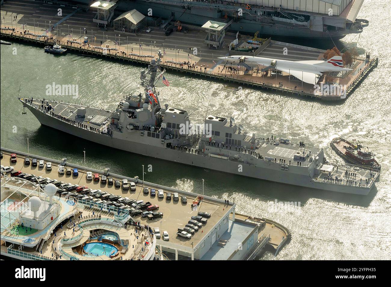 The crew of the Navy’s newest Arleigh Burke-class guided-missile ...