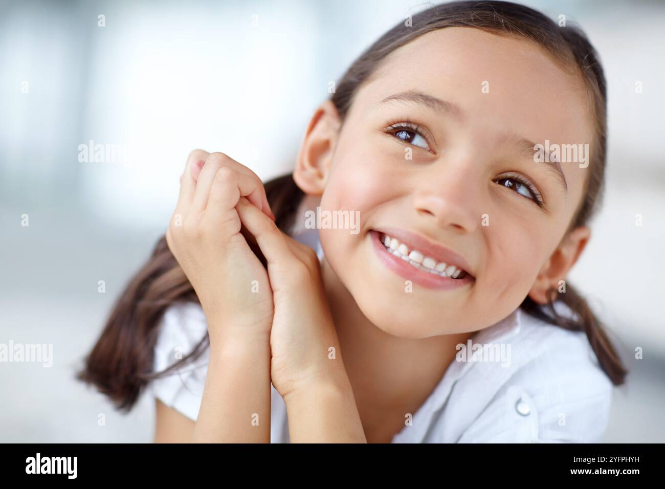 Face, smile and thinking with girl in home for daydreaming, fantasy or ...