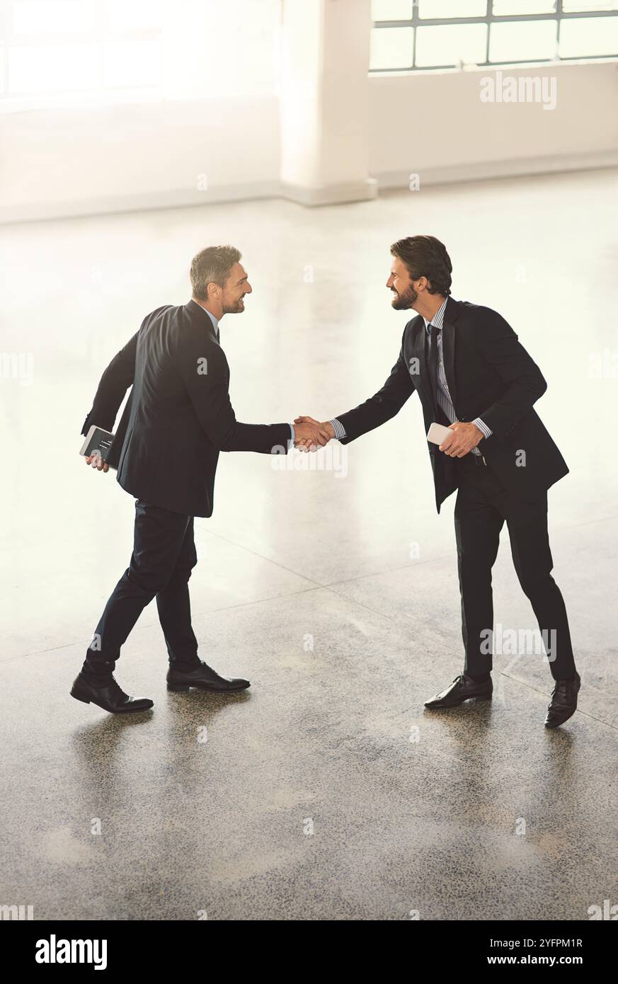 Above, business people and men with teamwork, handshake and partnership ...
