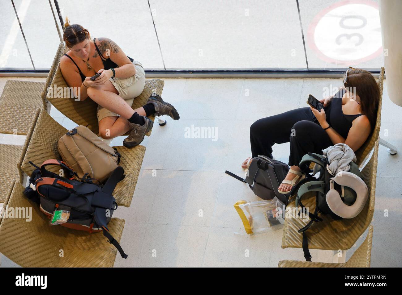 Passengers are waiting for their flight in departure hall of Phuket International Airport Stock ...