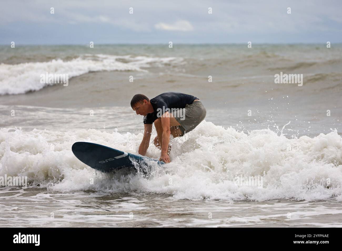Man surfing in waves hi-res stock photography and images - Alamy