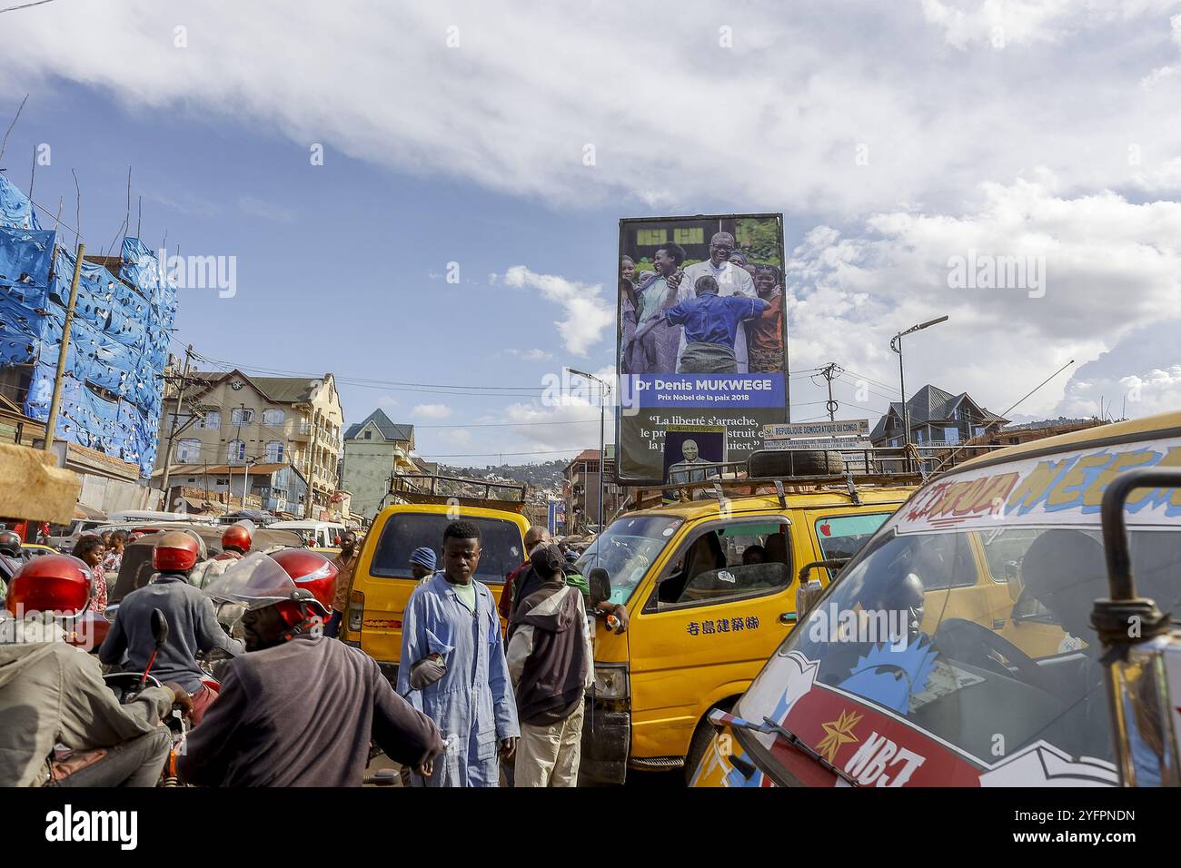 Crowd, traffic and Denis Mukwege billboard in Bukavu, DRC Stock Photo ...
