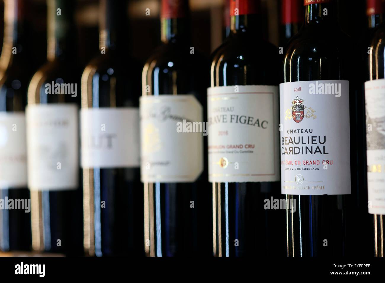 Selection of French wine bottles at a wine merchant. Red wine. France ...