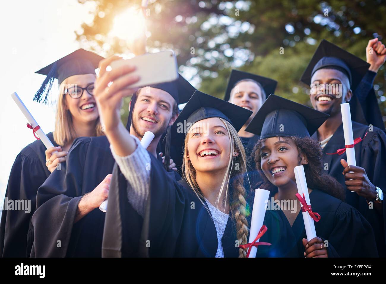 University students, graduation and smile for selfie with certificate ...
