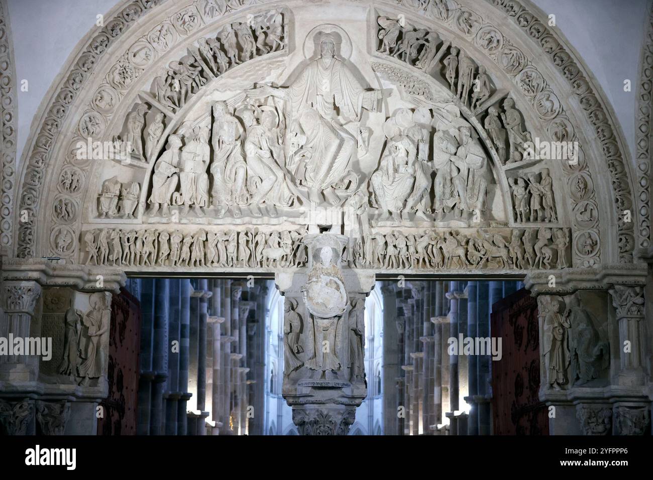 Benedictine abbey of Vezelay. Tympanum of the Narthex representing ...