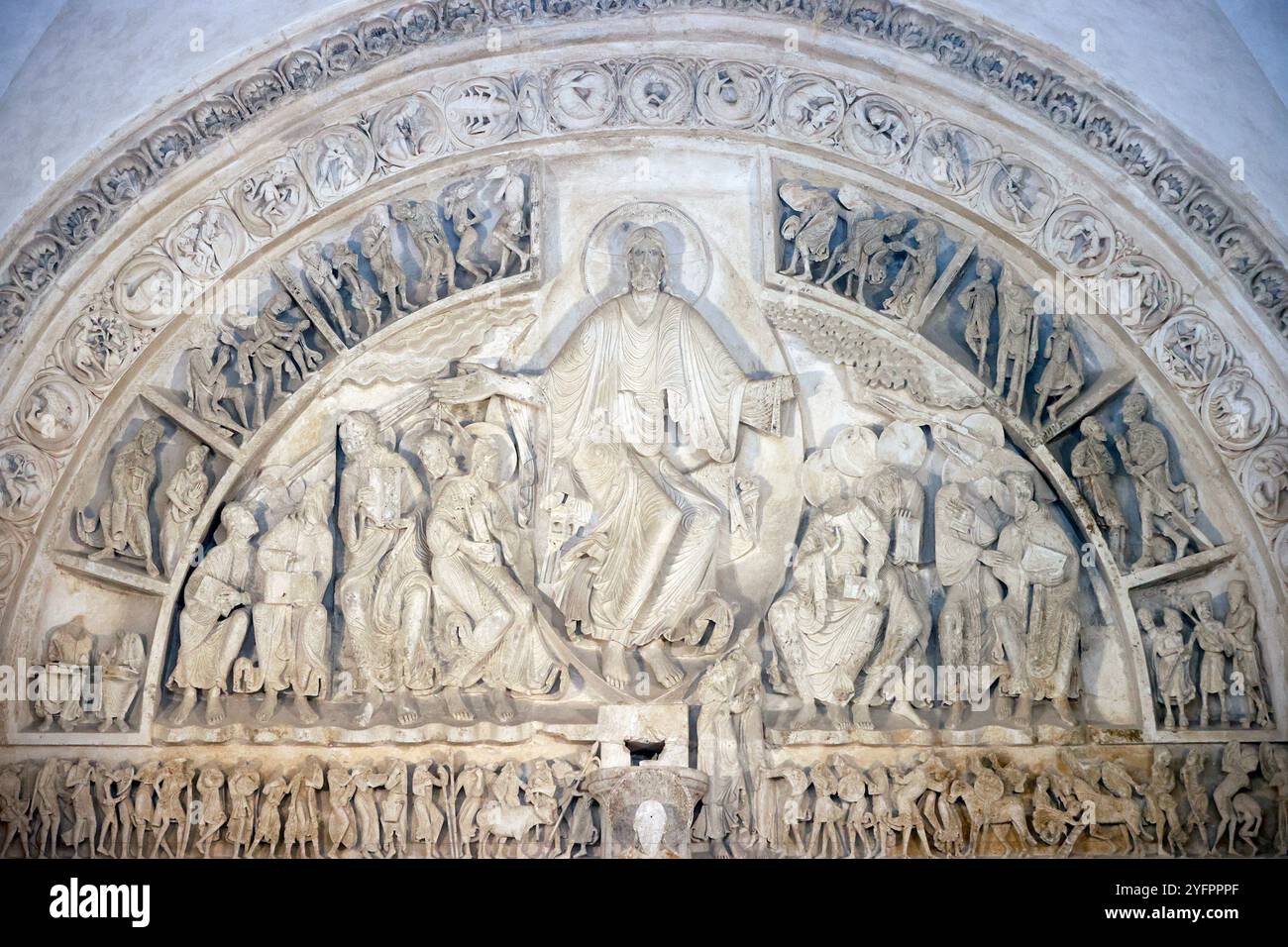 Benedictine abbey of Vezelay. Tympanum of the Narthex representing ...