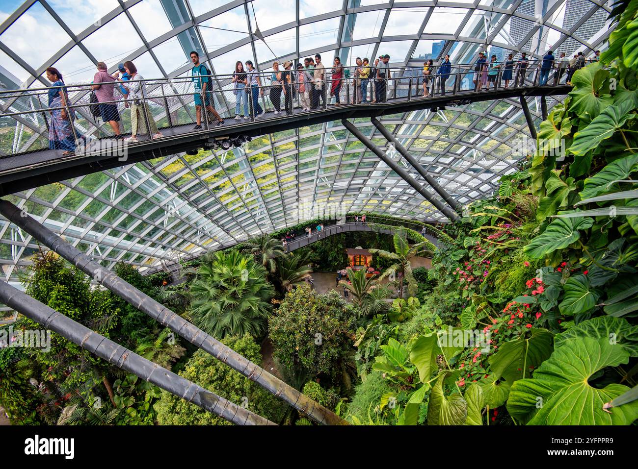 People enjoying the interior view of the gardens and part of the glass ...