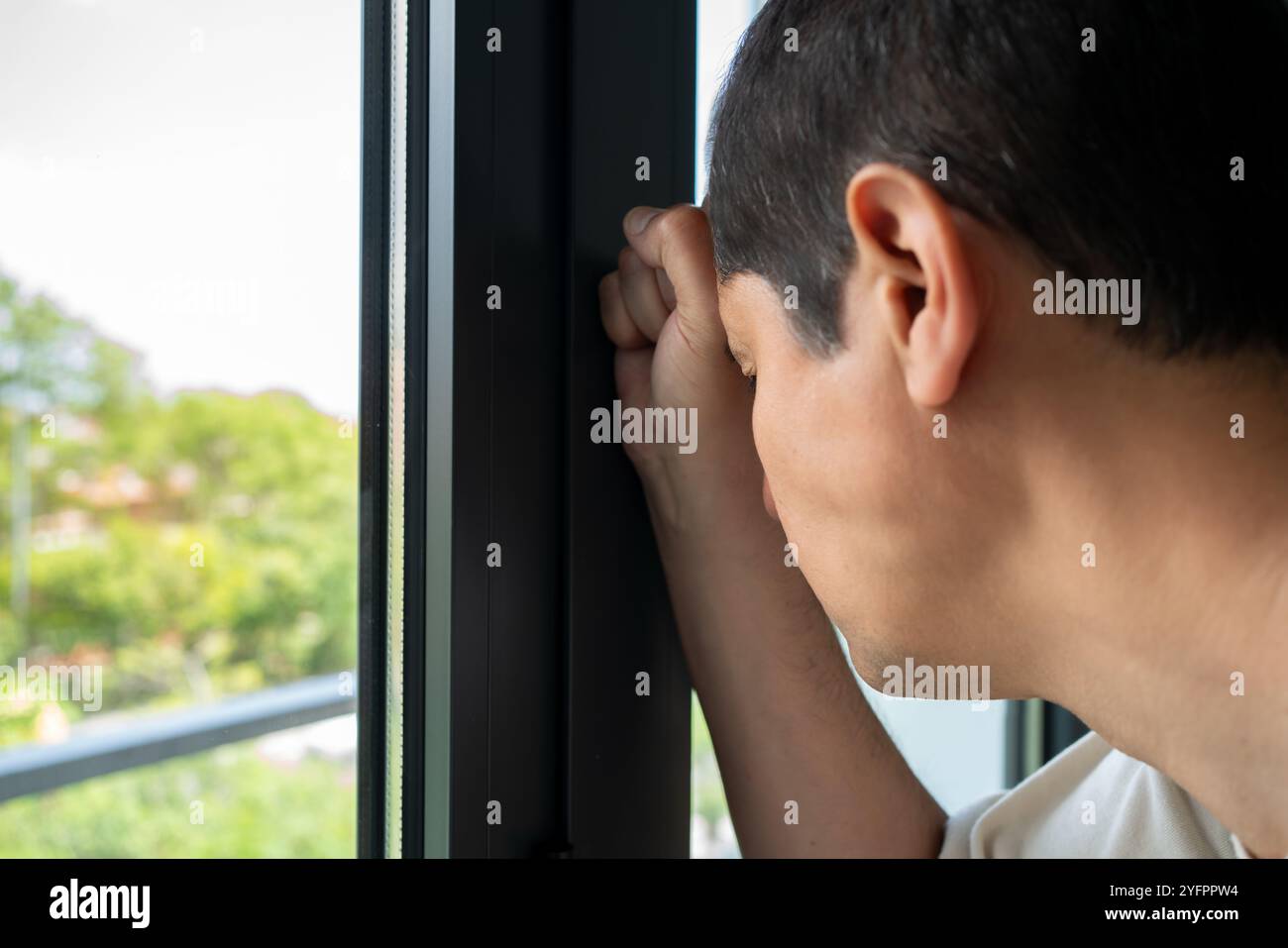 Side view portrait male sad hi-res stock photography and images - Alamy