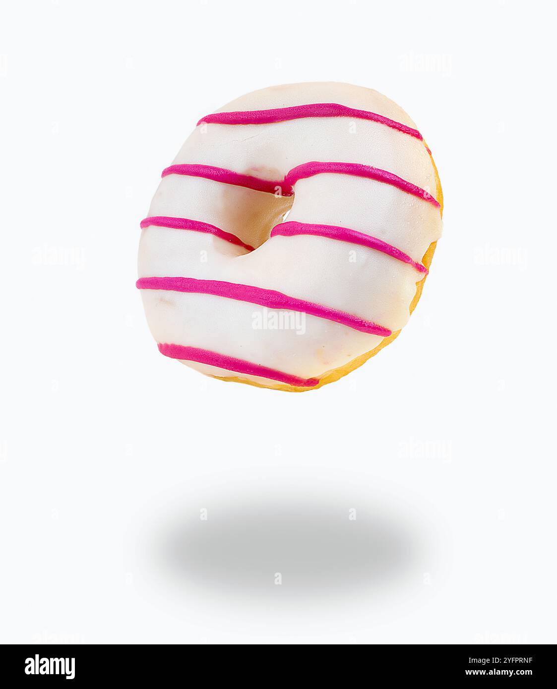 Flying donut made of chocolate white and pink stripes with isolated on ...