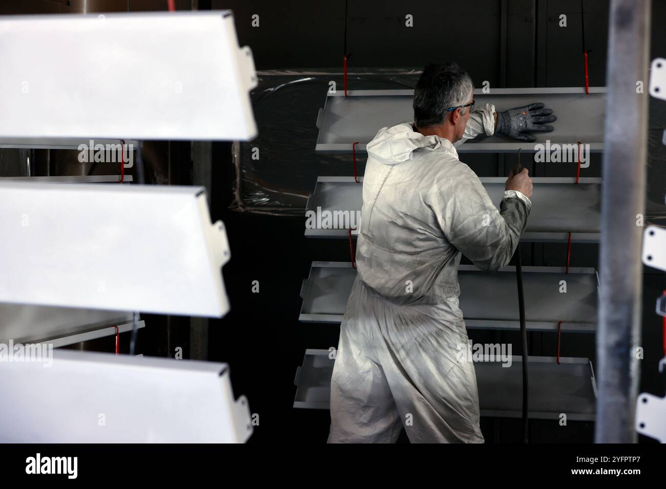 Industrial site. Worker in a factory. Manual work Stock Photo - Alamy