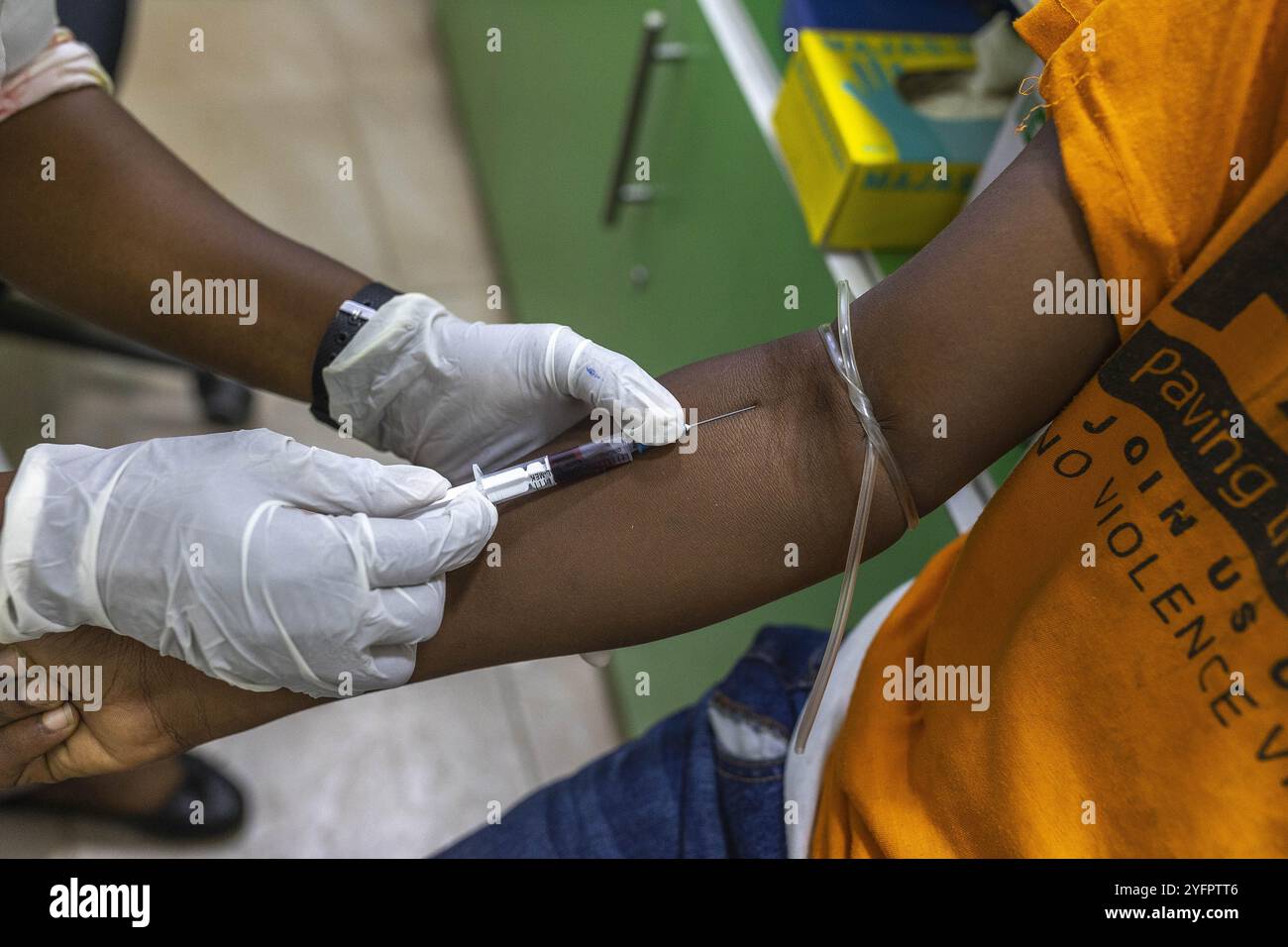 Nurse performing a blood test in a private hospital in Accra, Ghana ...