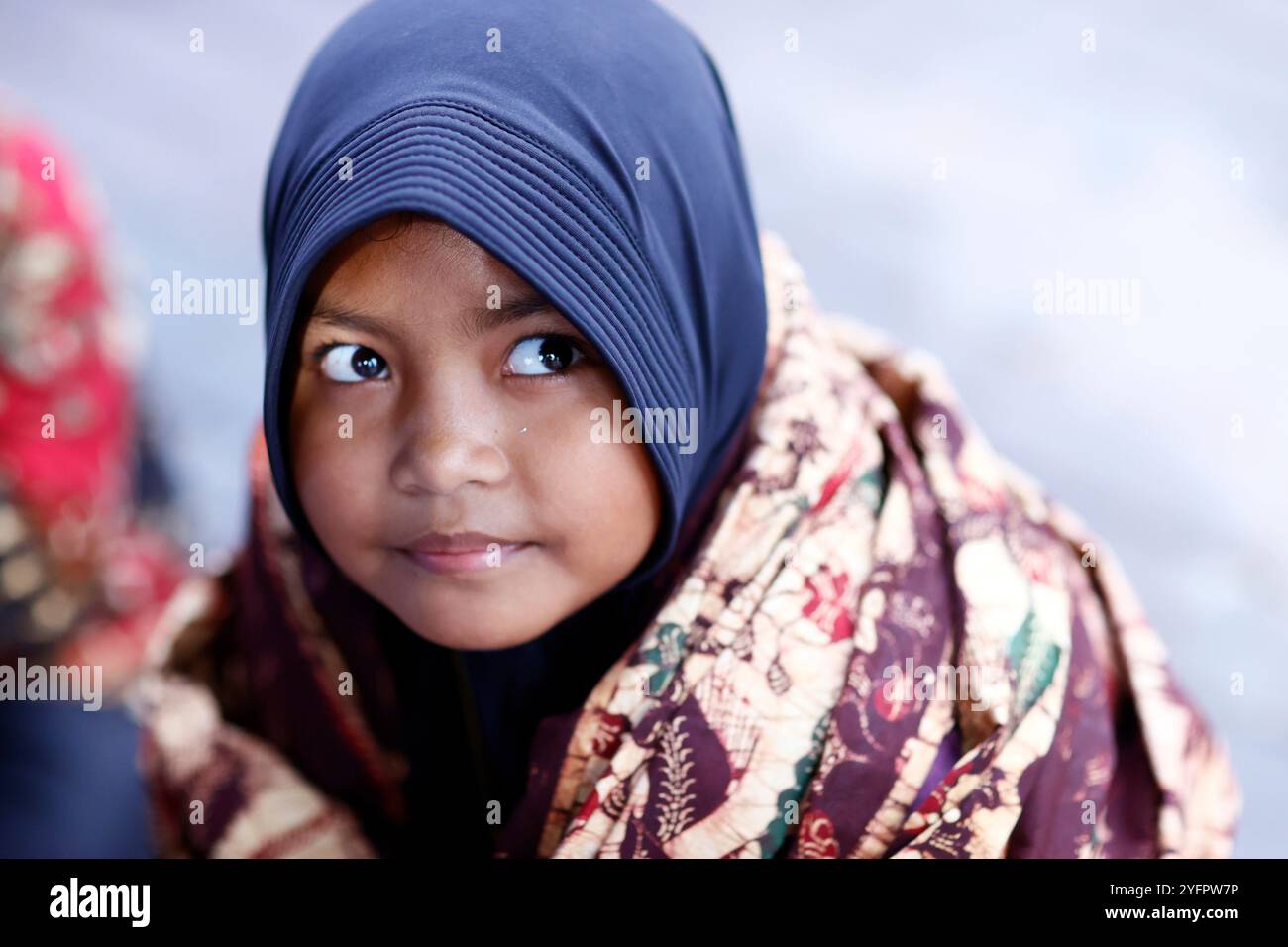 Indonesian girl wearing the traditional Islamic hijab veil. Indonesia ...
