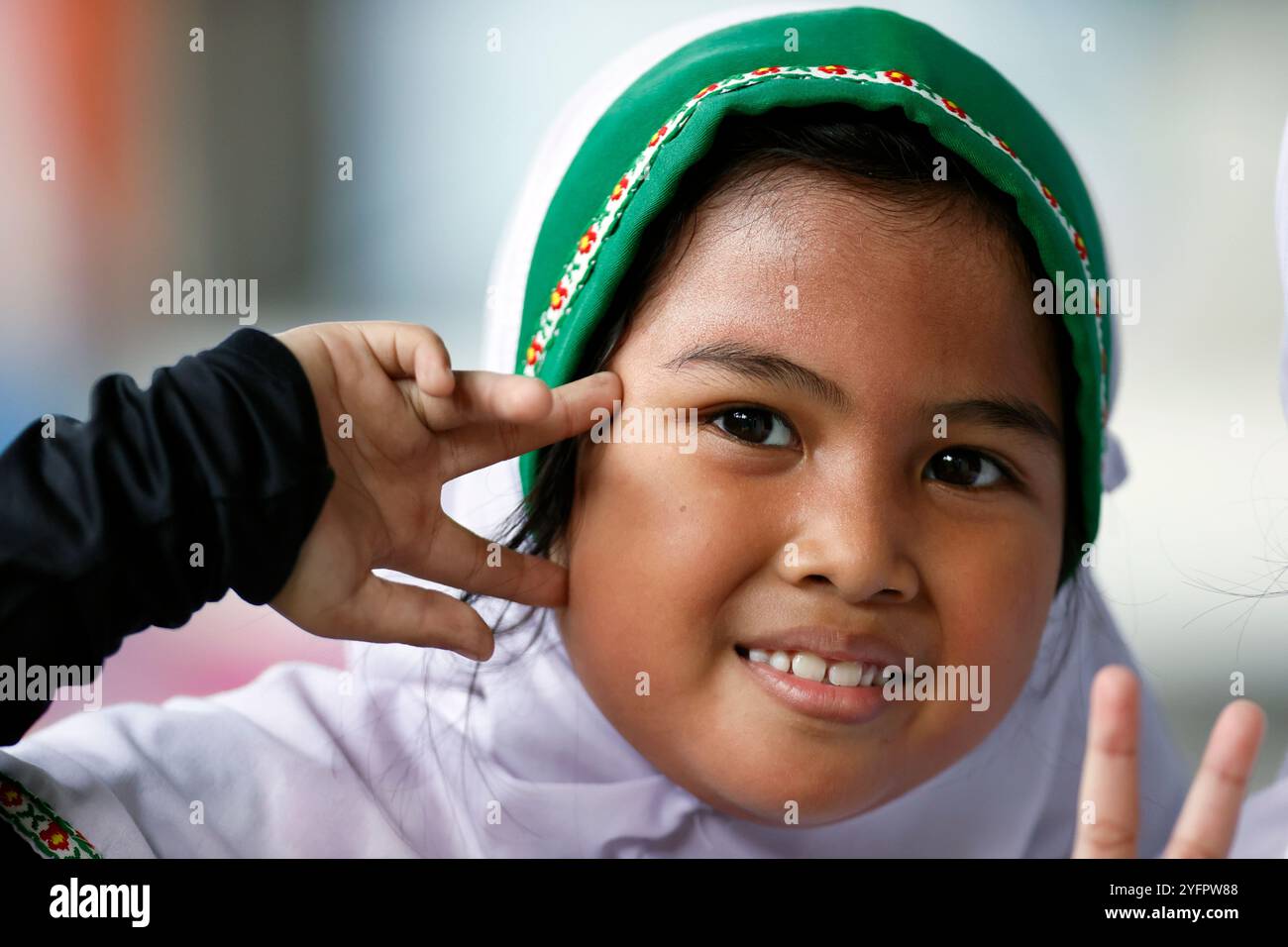 Indonesian girl wearing the traditional Islamic hijab veil. Indonesia ...
