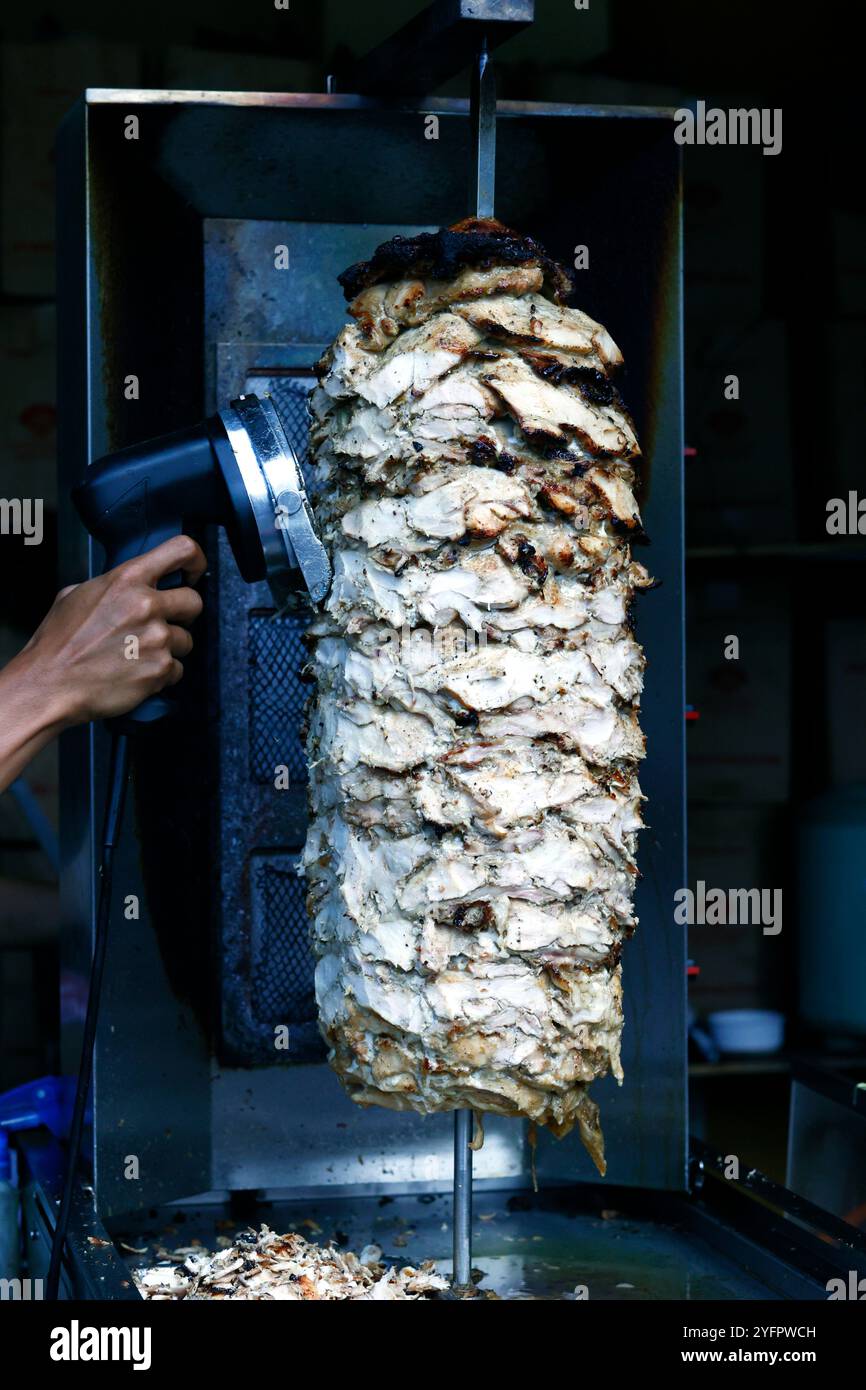 Döner kebab meat on vertical rotisserie. Surabaya. Indonesia Stock ...
