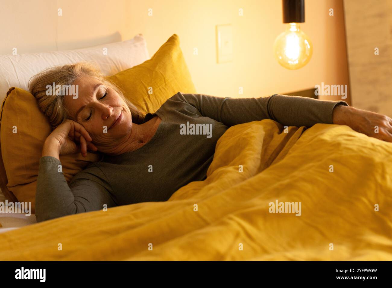 Elderly woman is sleeping peacefully in bed hi-res stock photography and images - Alamy