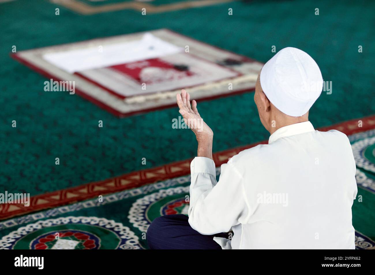Al Akbar Surabaya National Mosque. Muslim man praying and whorship ...