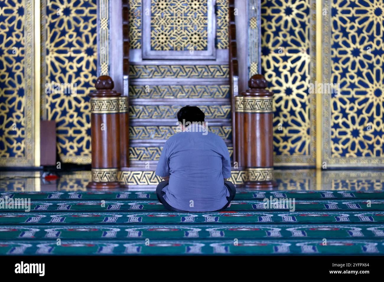 Al Akbar Surabaya National Mosque. Muslim man praying and whorship ...