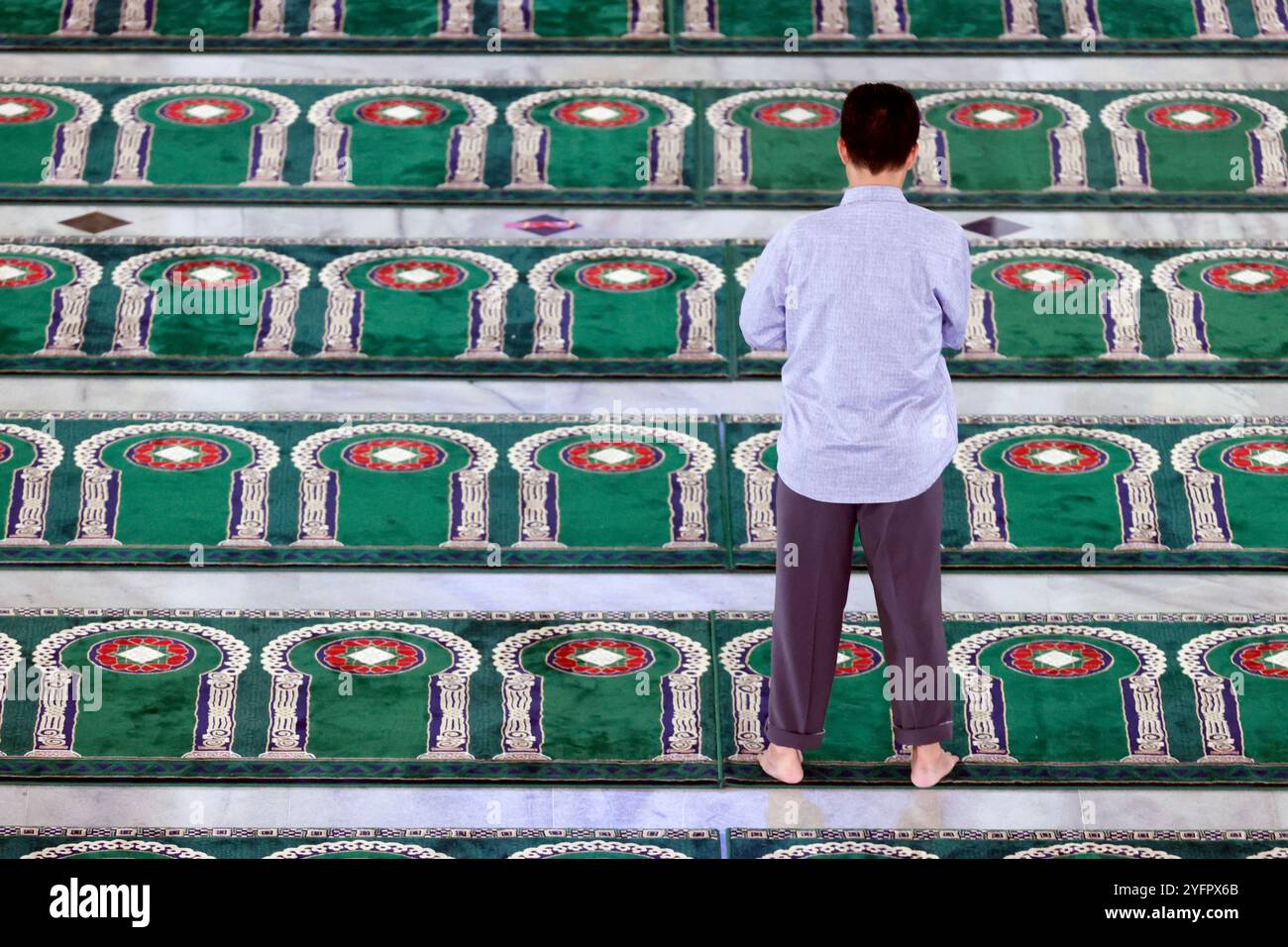 Al Akbar Surabaya National Mosque. Muslim man praying and whorship on ...