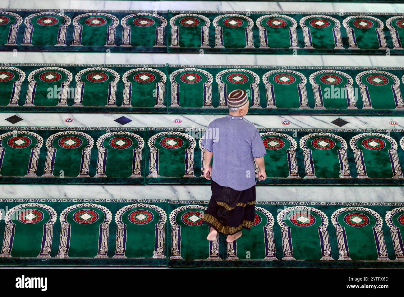 Al Akbar Surabaya National Mosque. Muslim man praying and whorship on ...