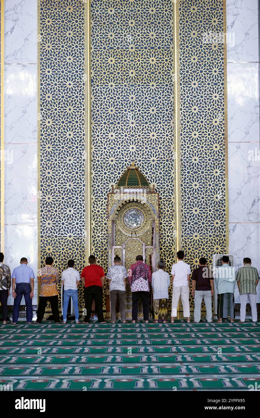 Al Akbar Surabaya National Mosque. Muslim men praying and whorship ...