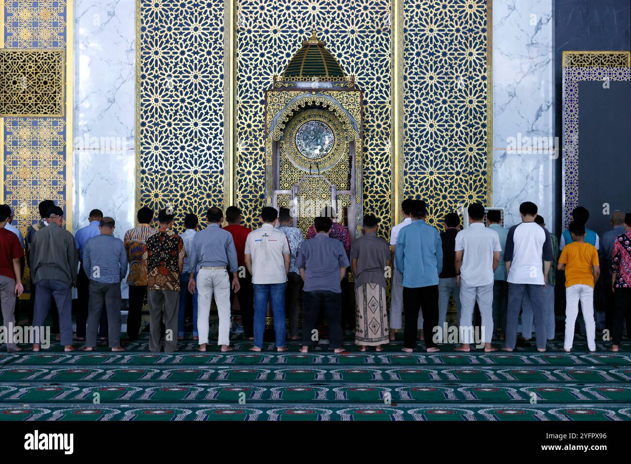 Al Akbar Surabaya National Mosque. Muslim men praying and whorship ...
