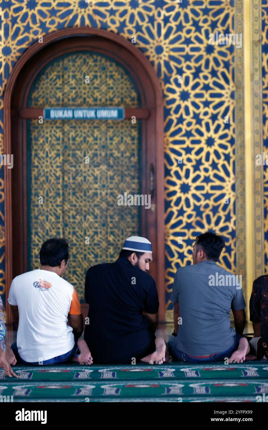 Al Akbar Surabaya National Mosque. Muslim men praying and whorship ...