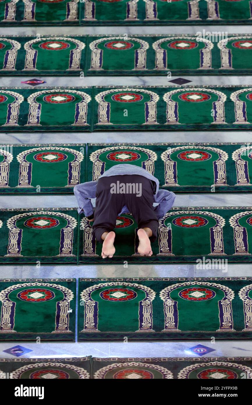 Al Akbar Surabaya National Mosque. Muslim man praying and whorship on ...