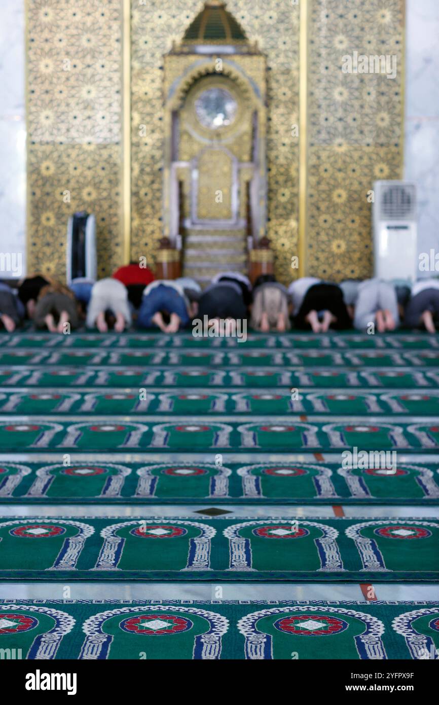 Al Akbar Surabaya National Mosque. Muslim men praying and whorship ...