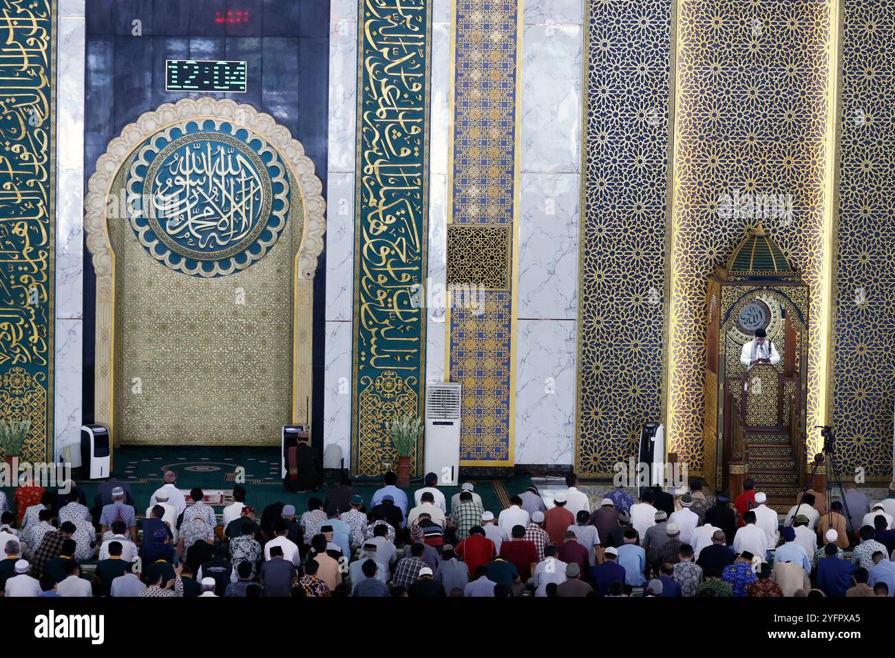 Al Akbar Surabaya National Mosque. Muslim men praying together at ...