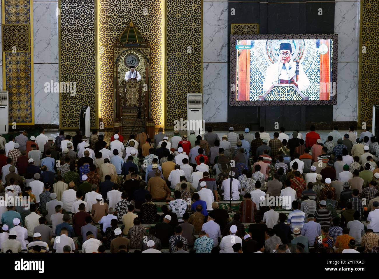 Al Akbar Surabaya National Mosque. Muslim men praying together at ...