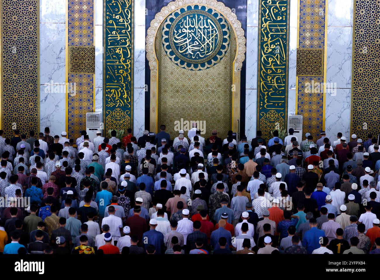 Al Akbar Surabaya National Mosque. Muslim men praying together at ...