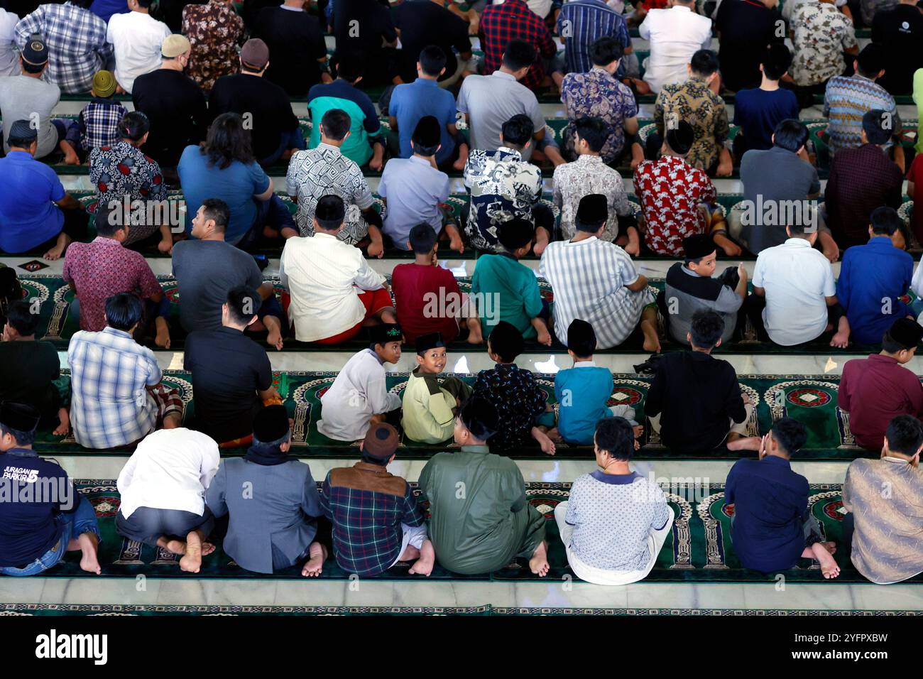 Al Akbar Surabaya National Mosque. Muslim men praying together at ...