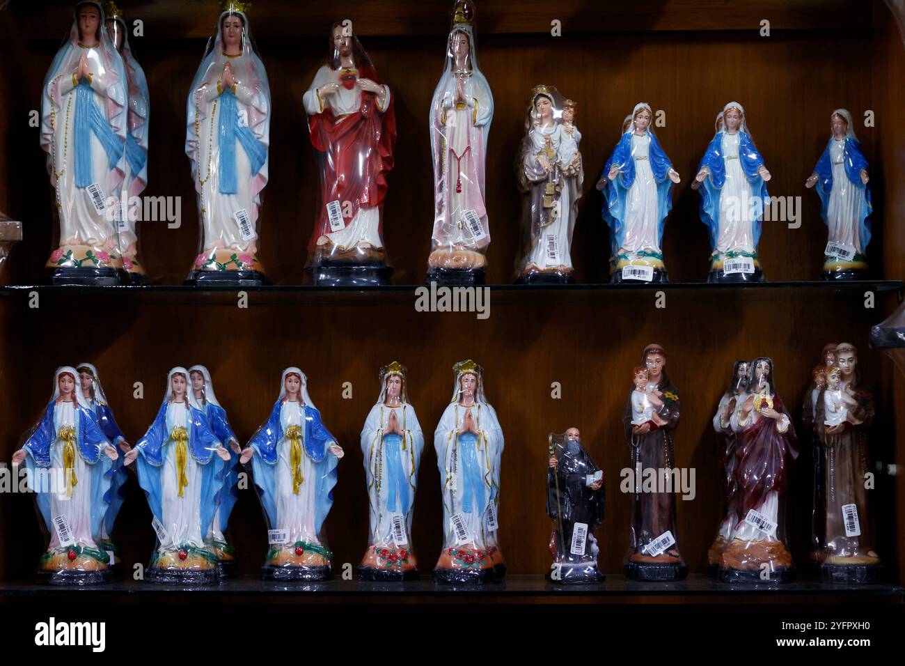 Religious articles for sale in a shop. Jesus and Virgin Mary. Surabaya ...