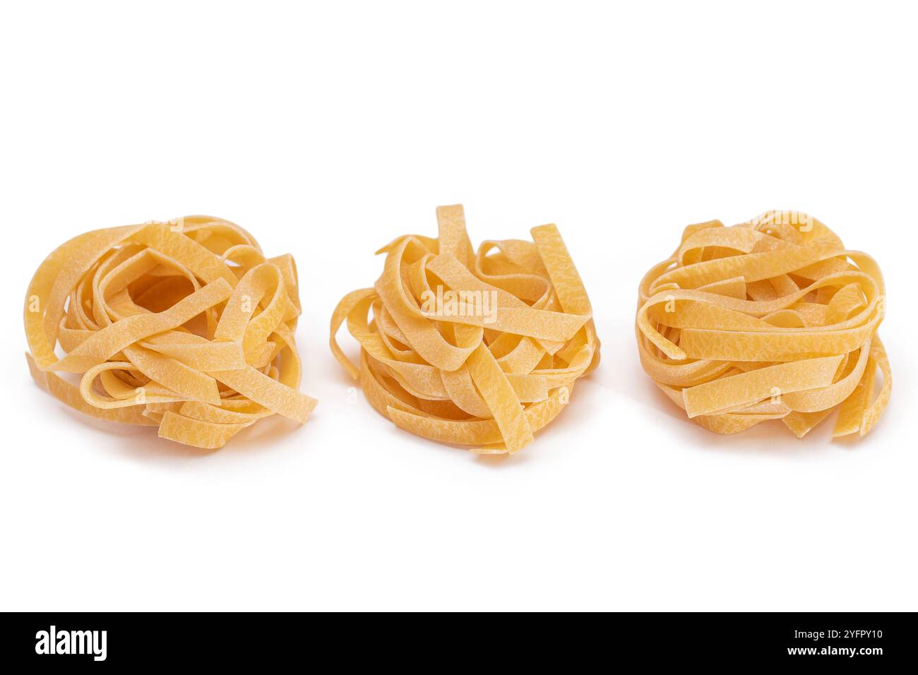 Three Classic Italian Raw Egg Fettuccine - Isolated on White Background ...