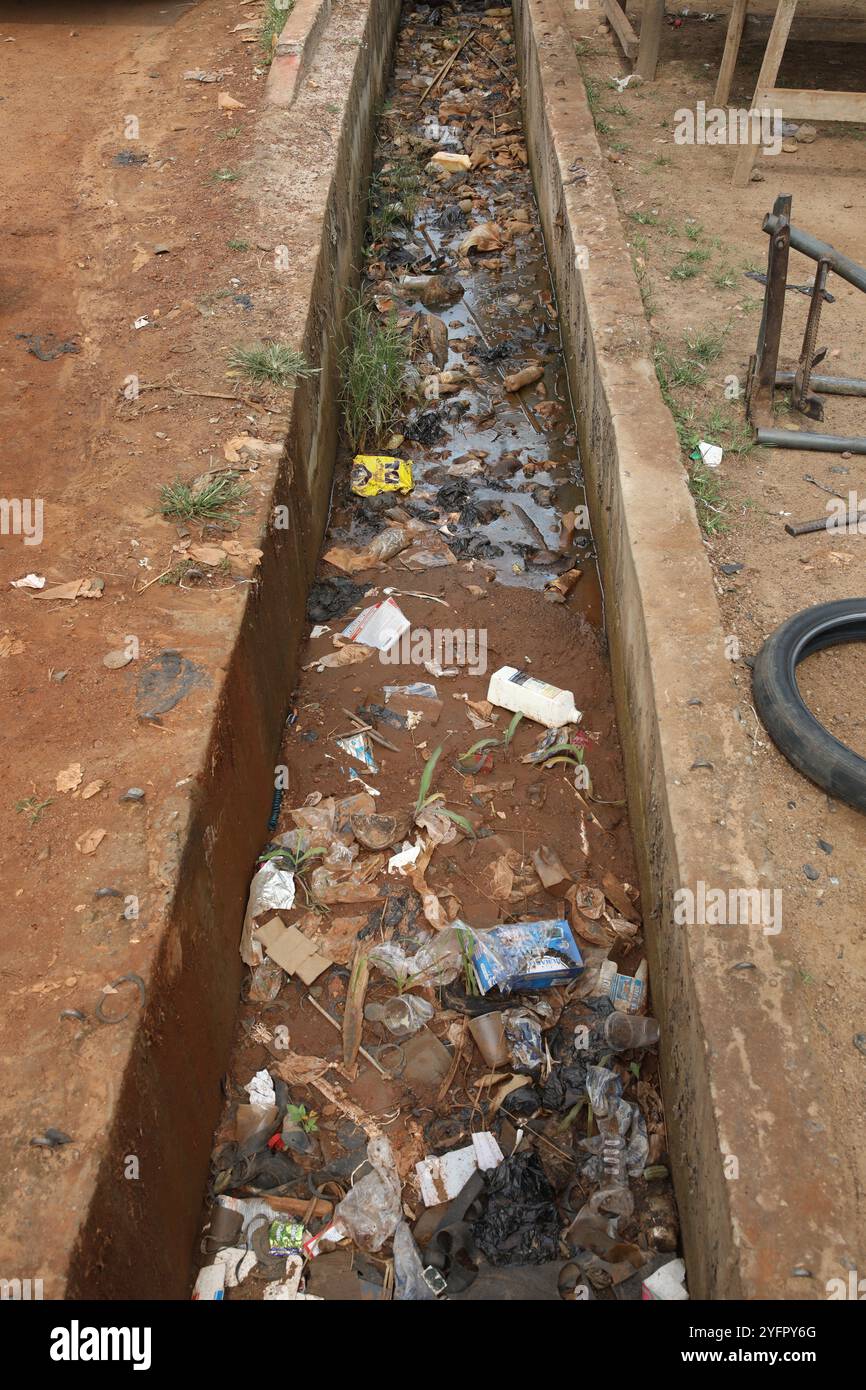 Trash in sewer in Amlame, Togo Stock Photo - Alamy